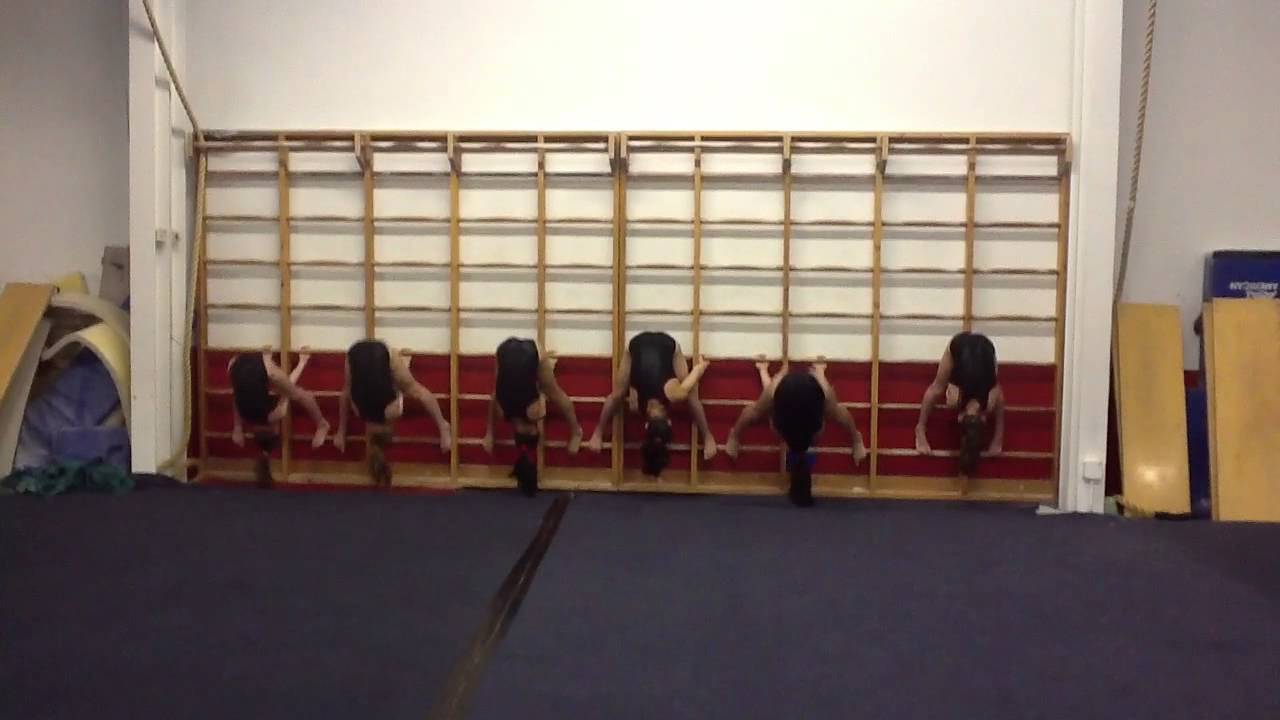 Flexibility using the stall bars for the straddle shape! - YouTube