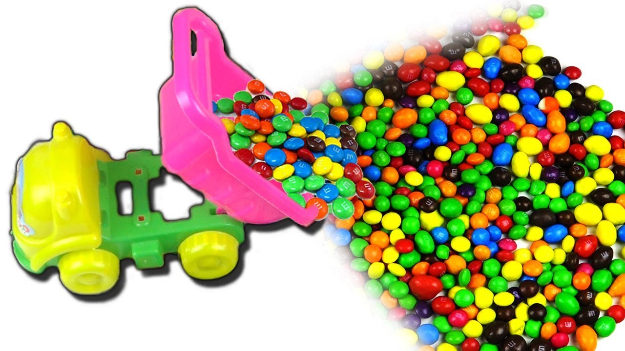 A small machine brings candy for children. Children's music. Children's ...