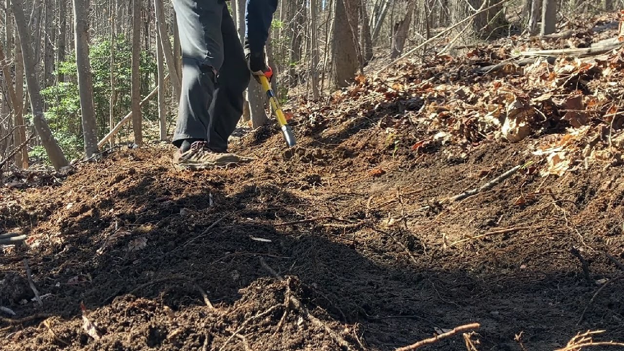 Building hiking trails on a hillside using hand tools - YouTube