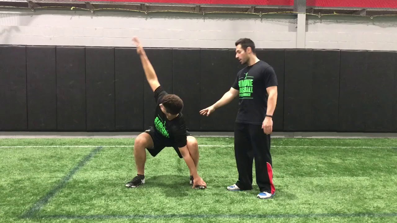 Squat to Stand W/Diagonal Reach - YouTube