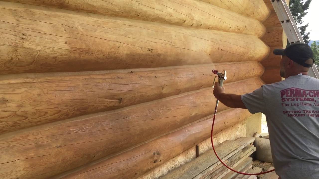 Staining a log home. - YouTube