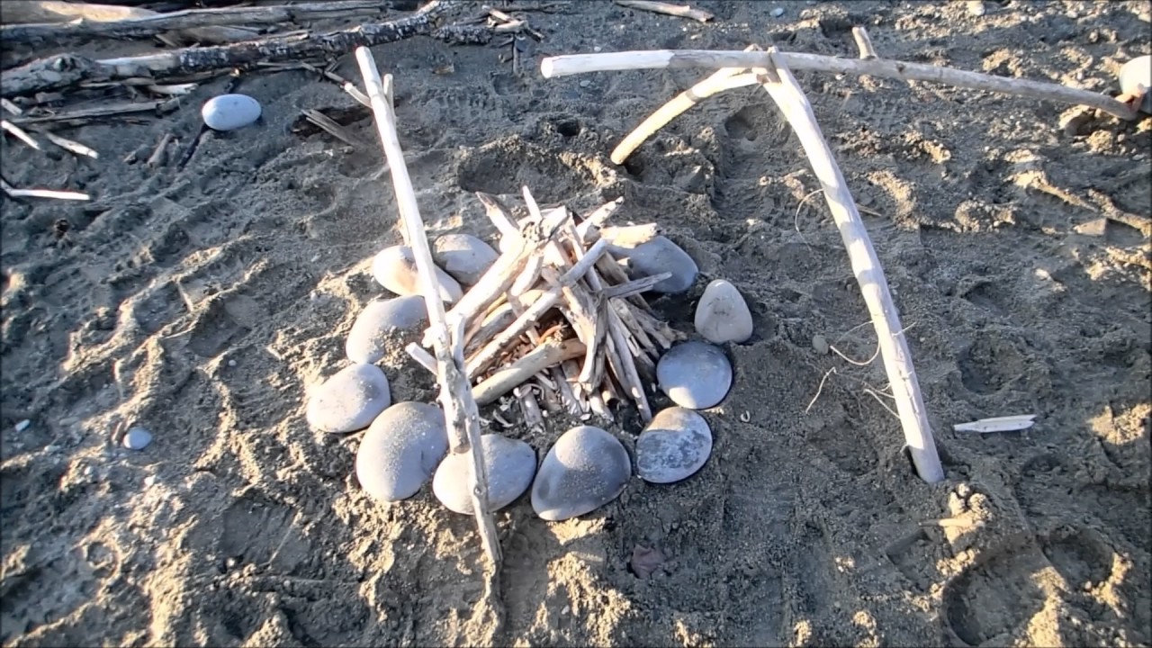Beach revisited. Chook and bread on the spit. - YouTube