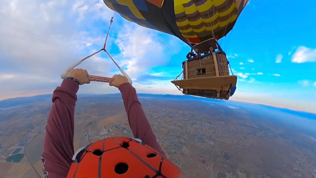 Base Jumper Launches From Rope Swing Attached To Hot Air Balloon - YouTube