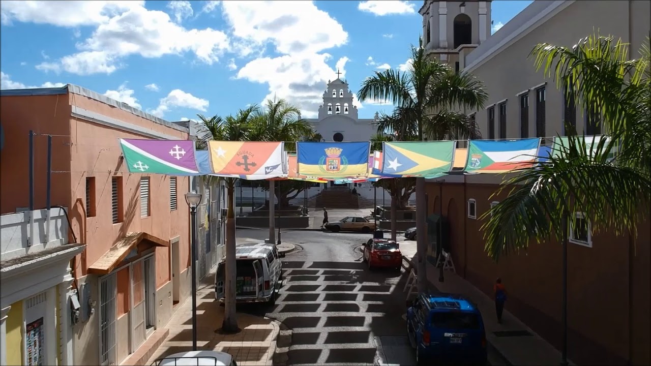 78 BANDERAS DE PUERTO RICO EN EL PUEBLO DE COAMO PUERTO RICO - YouTube