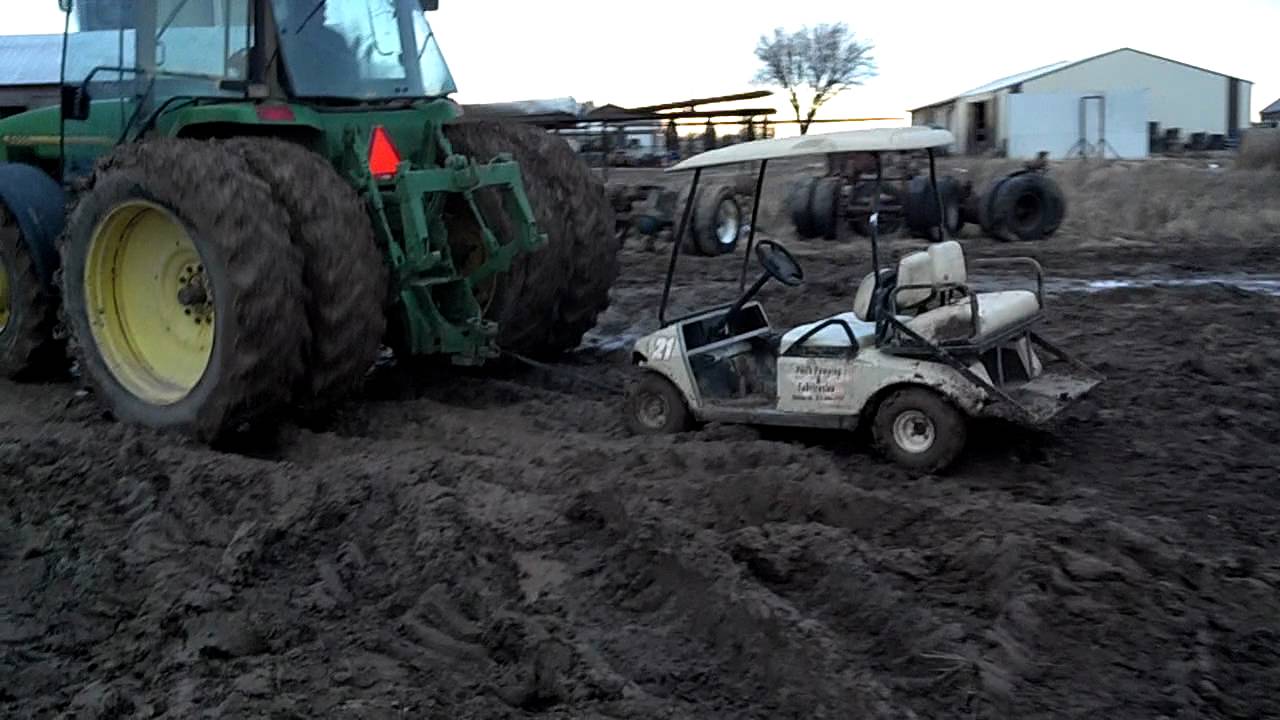 Chit Road Truckers - John Deere pulls out a stuck golf cart - YouTube