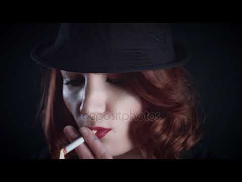 Girl smoking on black background