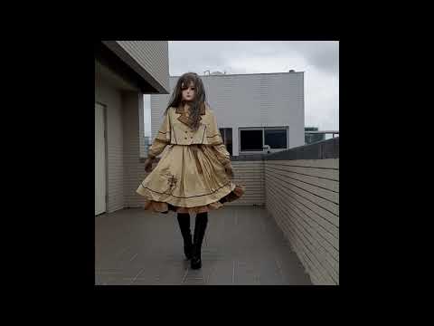 The skirt is blown up by the wind.