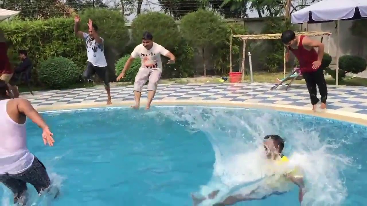 Slow-motion jumps in a swimming pool - YouTube