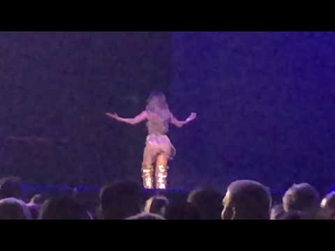 Jennifer Lopez walking down runway for wardrobe change during concert