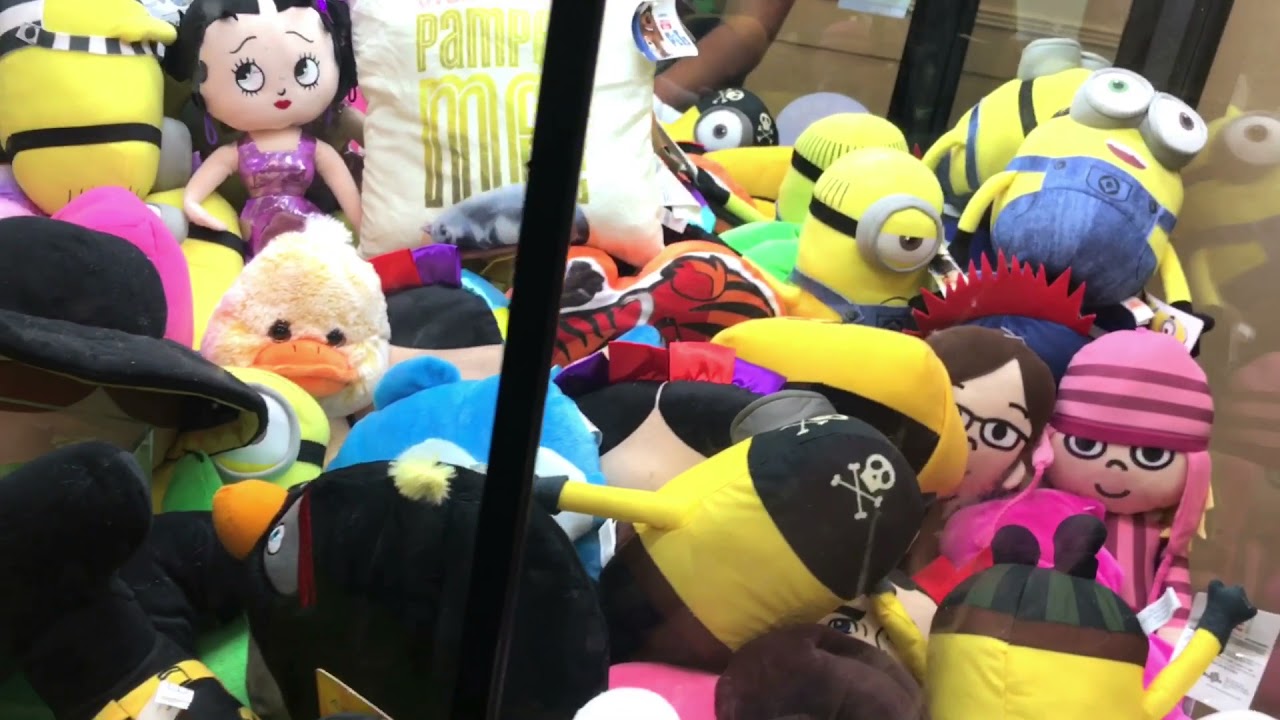 Winning plushes at the claw machine - YouTube
