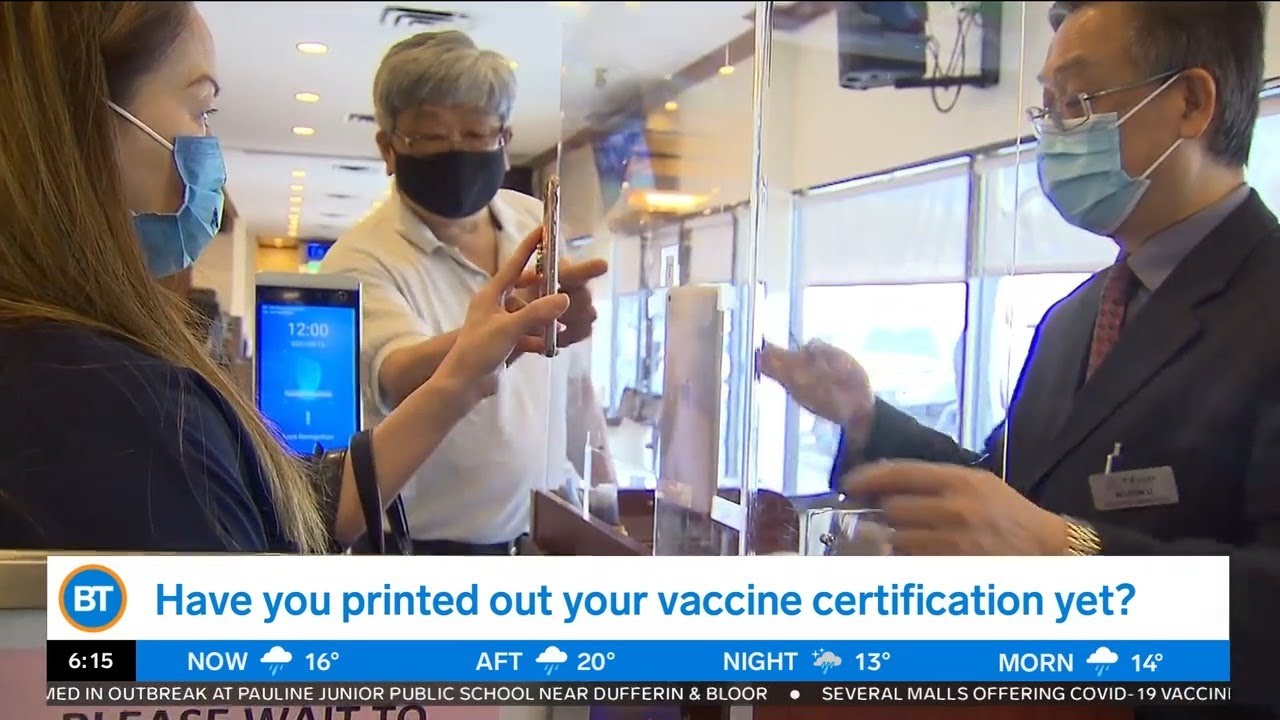 Business Report: Vaccine passports begin, 'Phoenix' payroll system ...