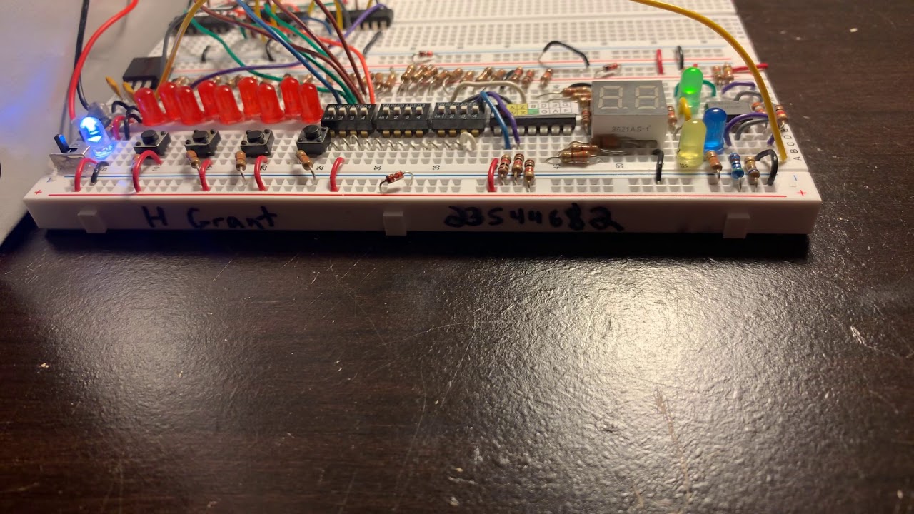 Bread board, switches wired to logic formula - YouTube