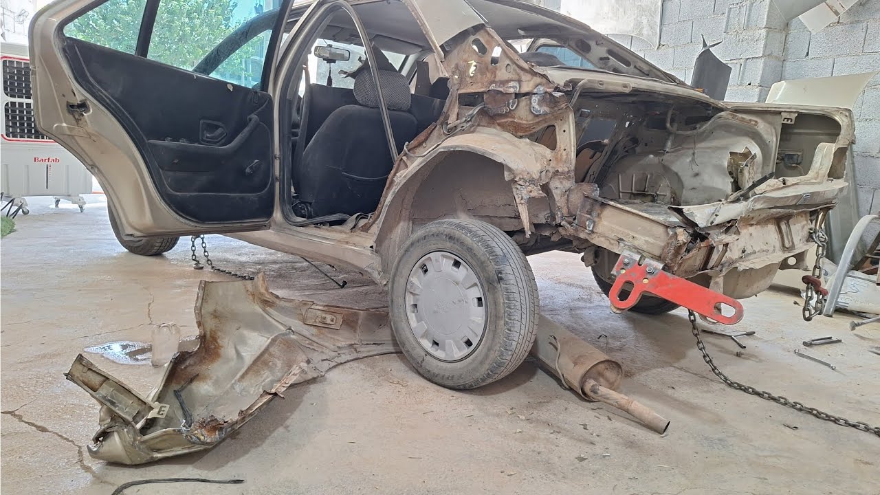 Reconstruction of the rear part of the accidental car,welding,cutting ...