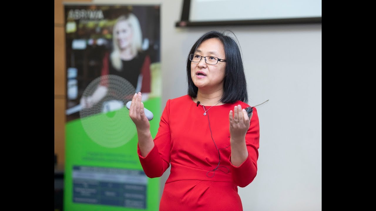 Dr Na Fu presenting at the Abrivia/Trinity College Breakfast Briefing ...