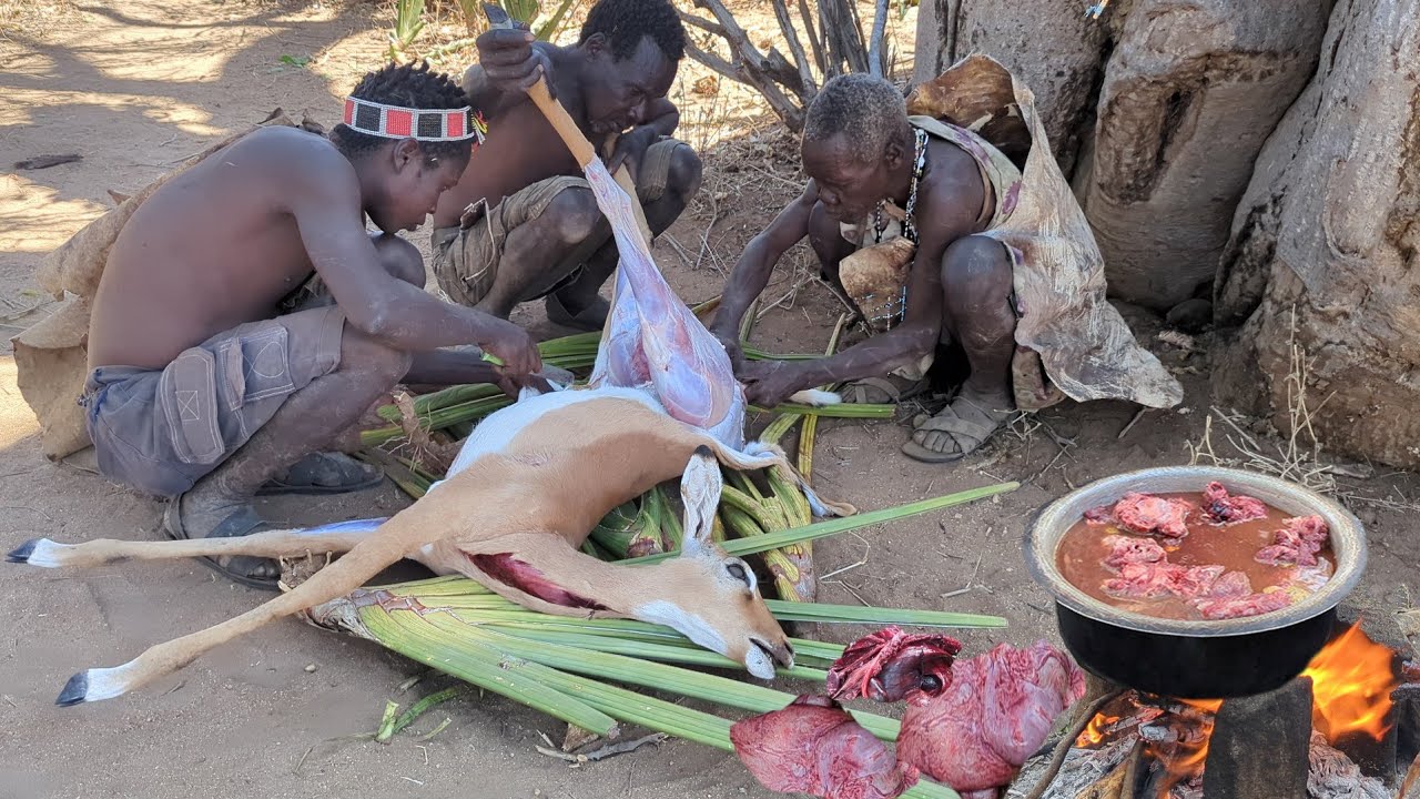 Hadzabe tribe hunting Antelope and Cooking lunch. - YouTube