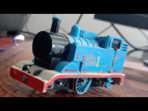 photos of well loved and damaged thomas toys with sad music