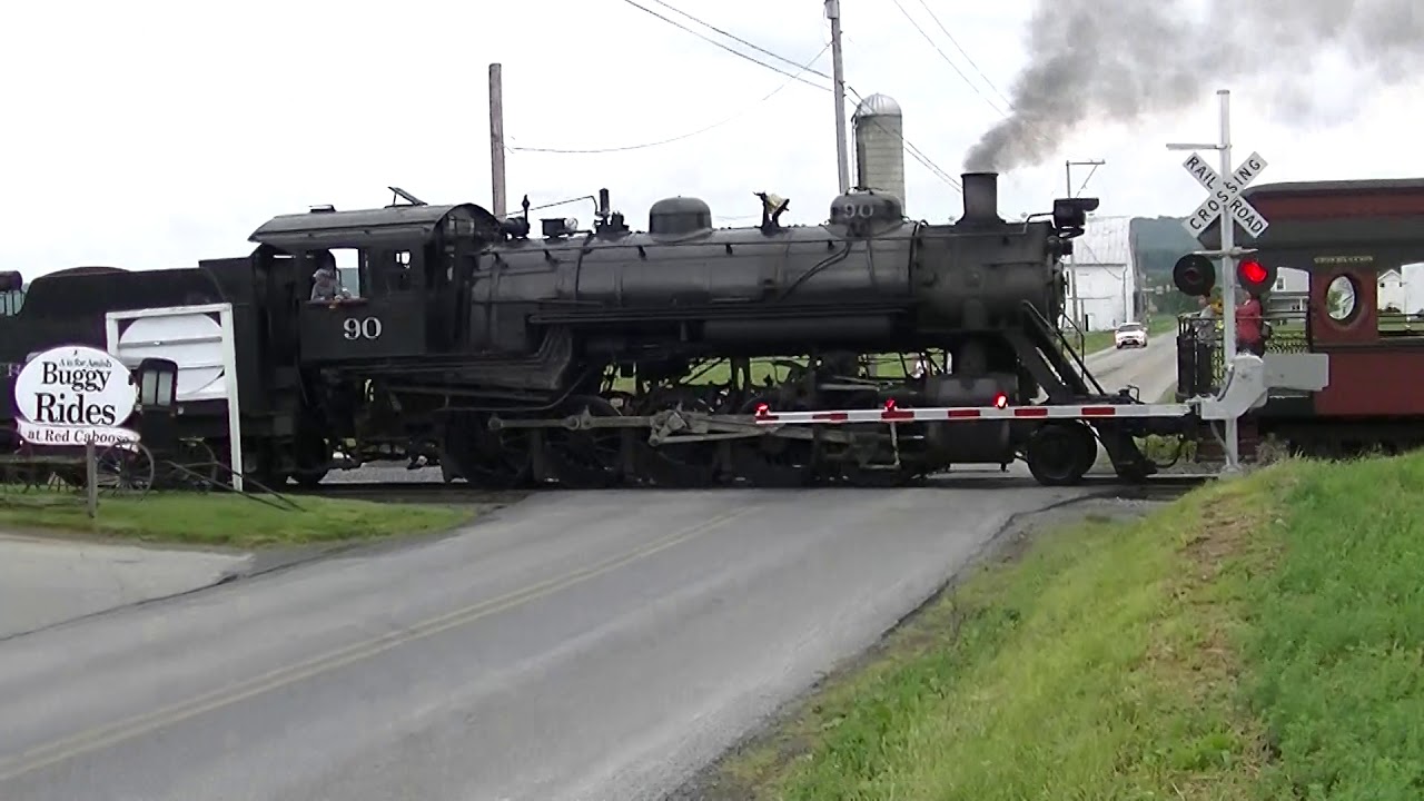 Vintage steam train passes through Amish Country level crossing - YouTube