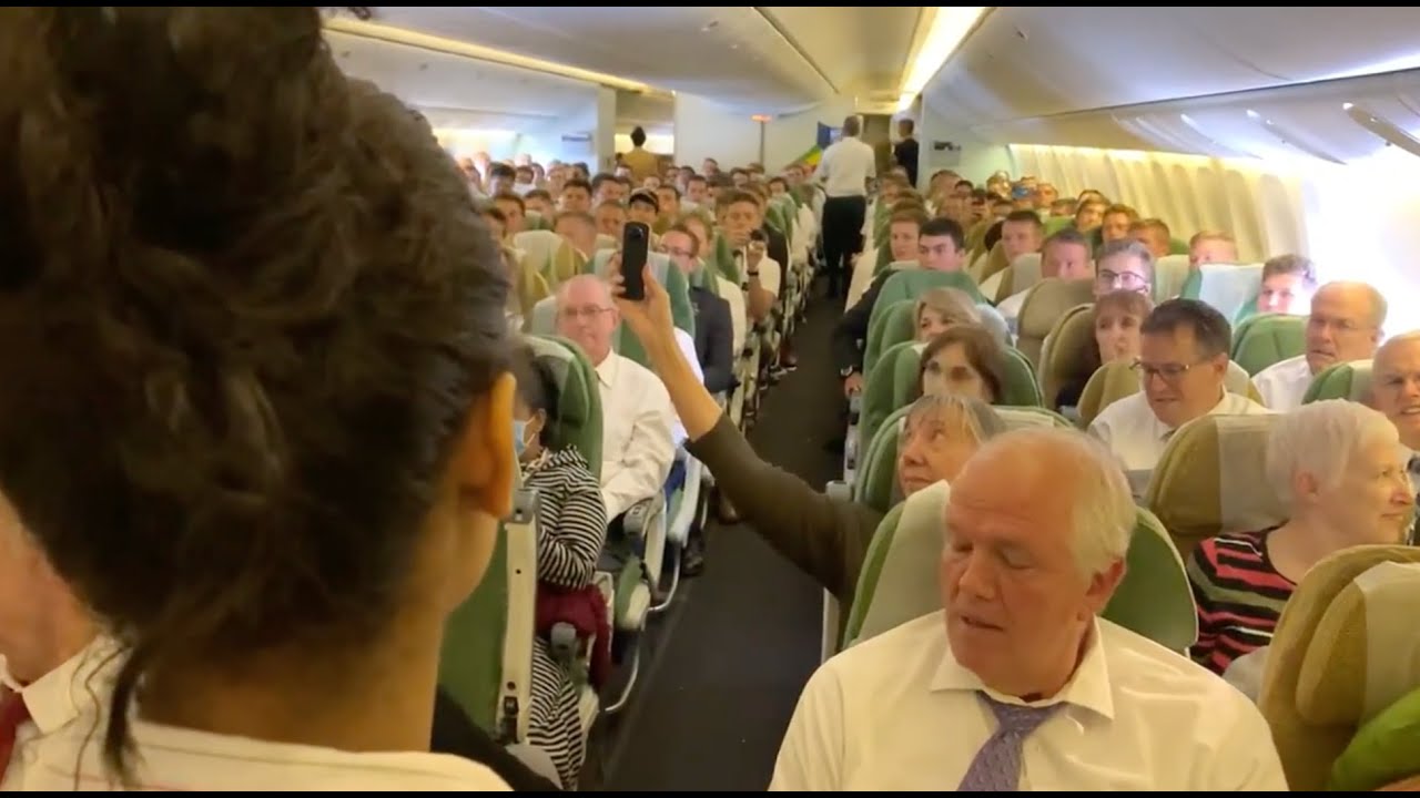LDS Missionaries Singing on Plane from Africa - YouTube