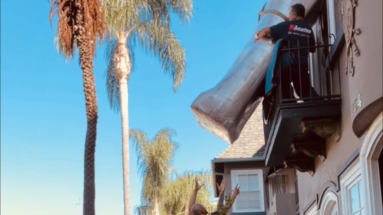 hoisting down a sofa from small balcony - YouTube