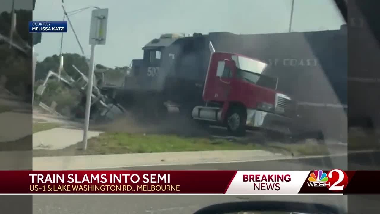 Train slams into semi-truck stalled on tracks in Florida - YouTube