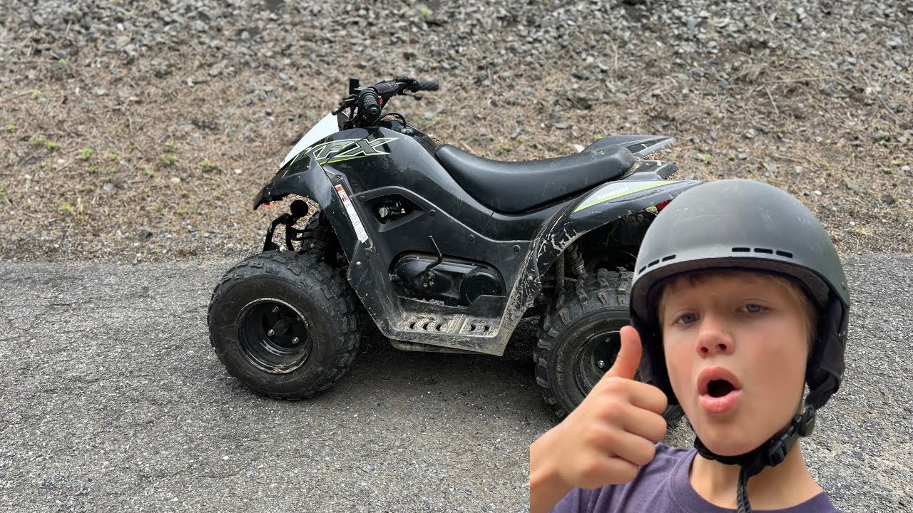 Using my four wheeler on the road - YouTube