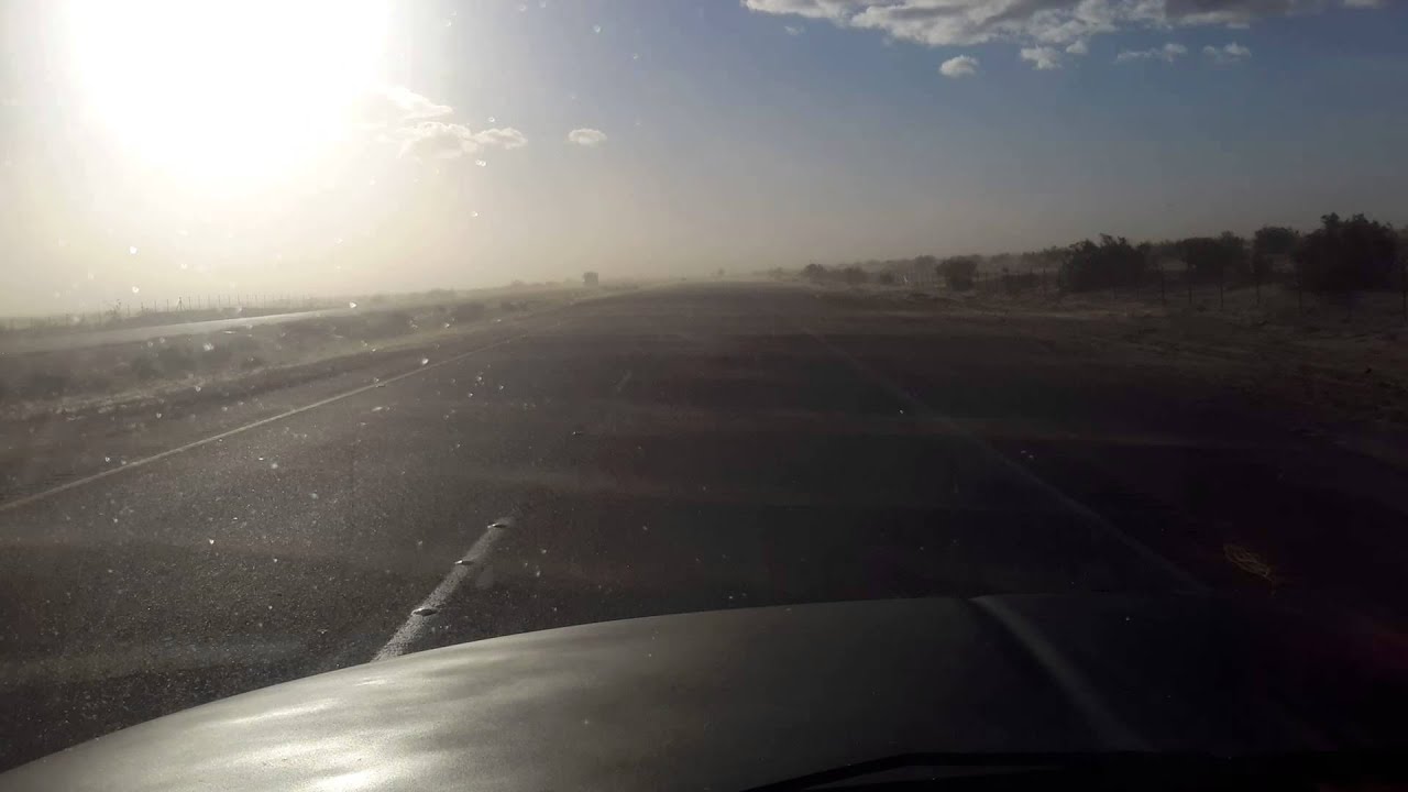 Driving through a small sandstorm. - YouTube