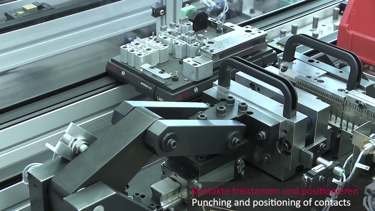 Robot-based assembly for connector pins before overmolding - YouTube