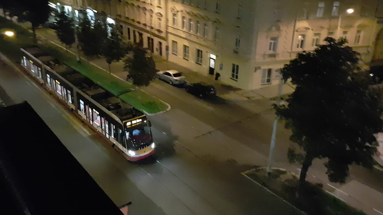 Prague tramway seen from rooftop balcony at night - YouTube