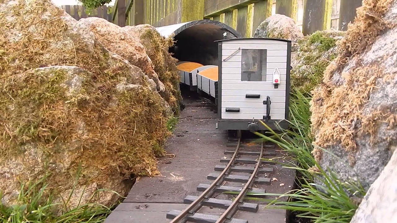 A train entering the tunnel on my 16mm Garden Railway - YouTube