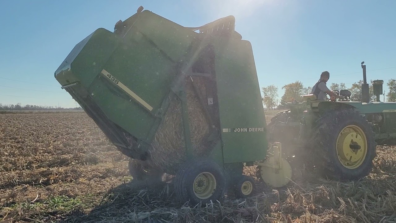 Baling corn stalks with a John Deere 4020 and 435 Round Baler with net ...