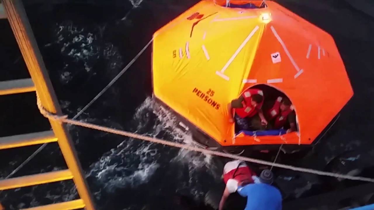 Tugboat hauling space shuttle tank makes dramatic sea rescue - YouTube
