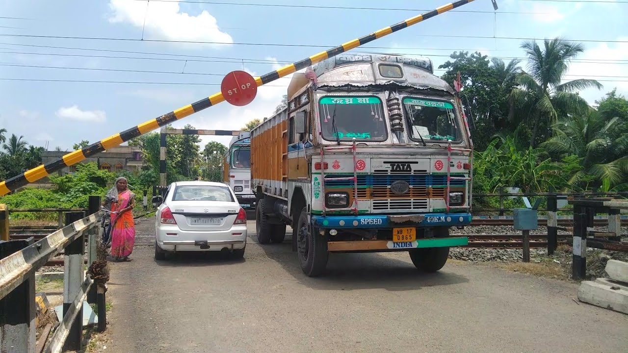 Gateman in Trouble Loaded Trucks Crossing Railgate : High Speed train ...