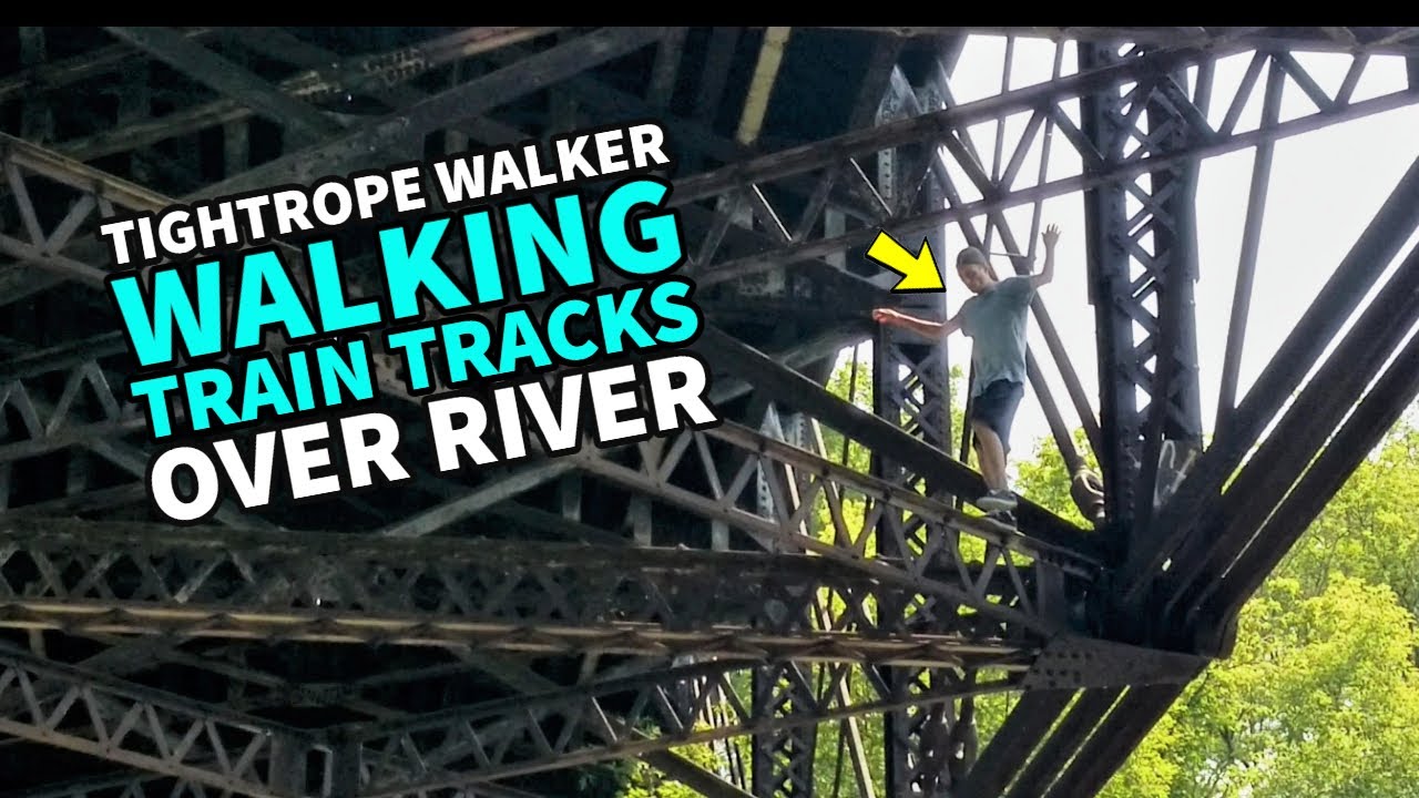 Tightrope Walker Walks Train Tracks Over River - YouTube