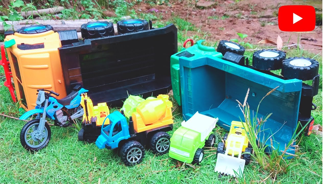 two dump trucks overturned carrying trail bikes,dump trucks, excavators ...