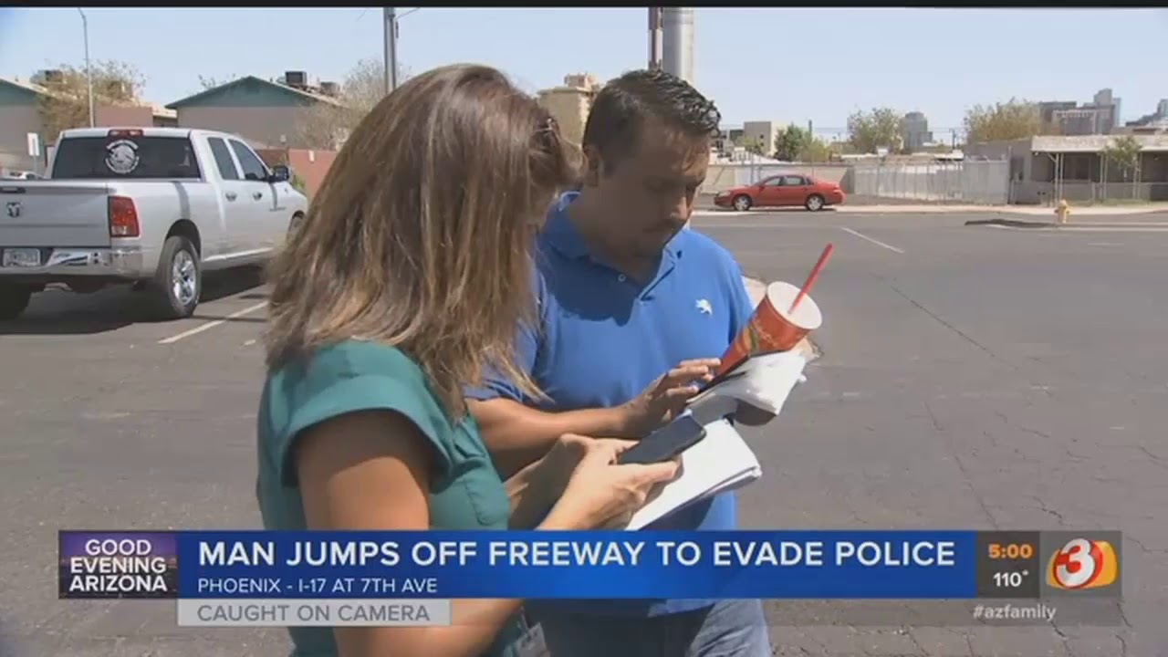 VIDEO: Man jumps off freeway to evade police - YouTube