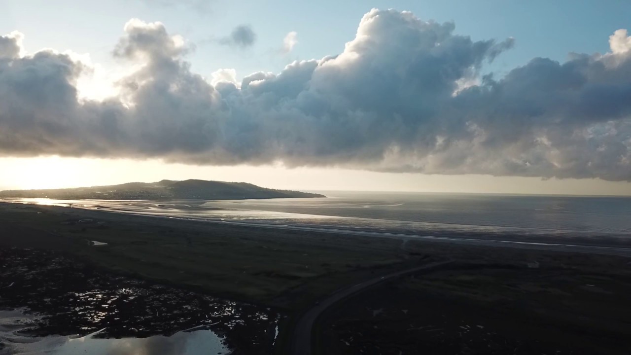 Clontarf promenade. Drone flight to Howth after sunrise Dublin, Ireland ...