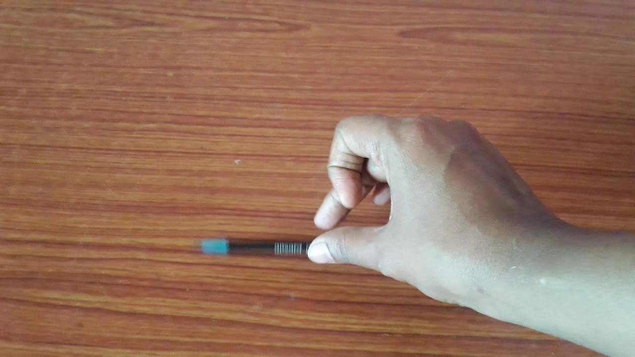 PUTTING PENCIL ON THE WOODEN TABLE - YouTube