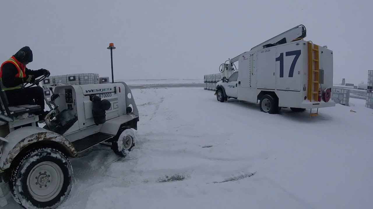 WORKING AT AN AIRPORT IN A SNOW STORM !!! - YouTube