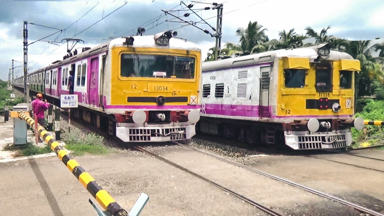 Local train crossing at a very busy level crossing - YouTube