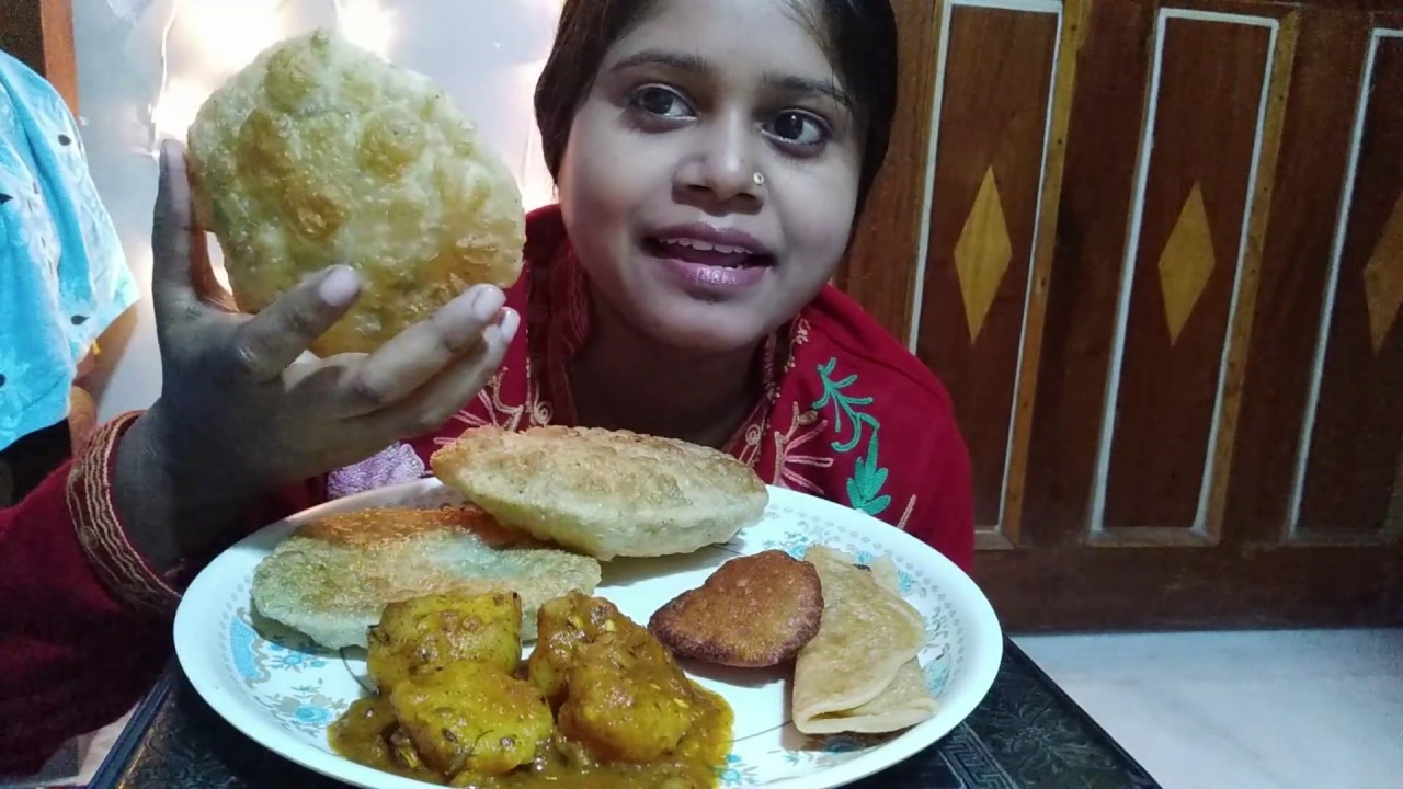Eating karaishutir kochuri , Kashmir dam alu , patishapta and mulpoa ...