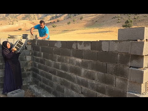 Nomadic love: Building the husband's dream house for the sheep.