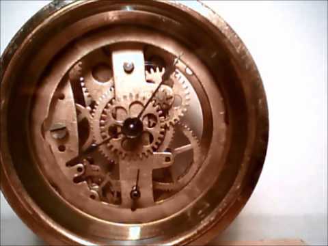 Skeleton Clock - antique small brass clock showing accelerated spinning ...