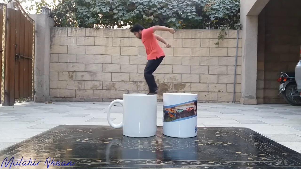 Guy Does Cool Optical Illusion Trick of Jumping Into Drinking Cup ...