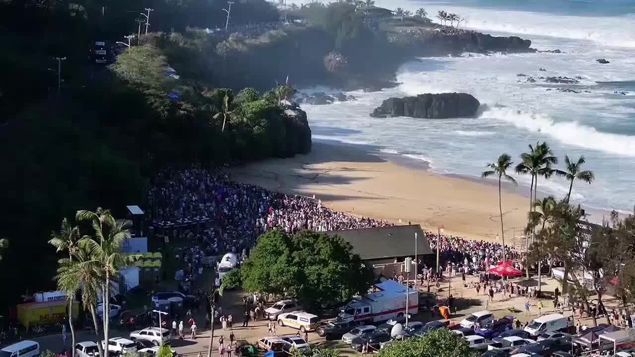 ‘The Eddie’ is on! Tens of thousands gather on North Shore for big wave ...