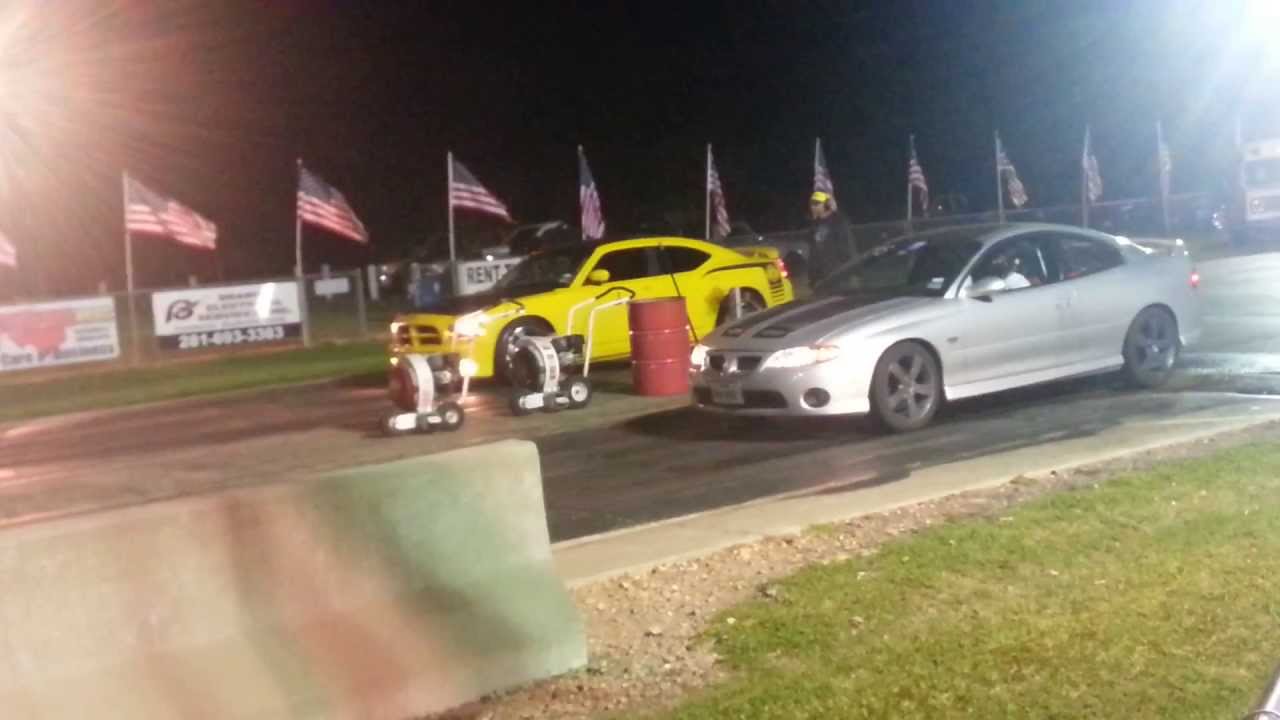 SRT8 charger vs 6.0 GTO - YouTube