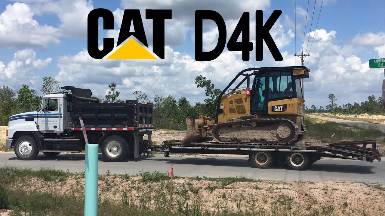 Loading and moving a CAT D4K 2 LGP dozer - YouTube
