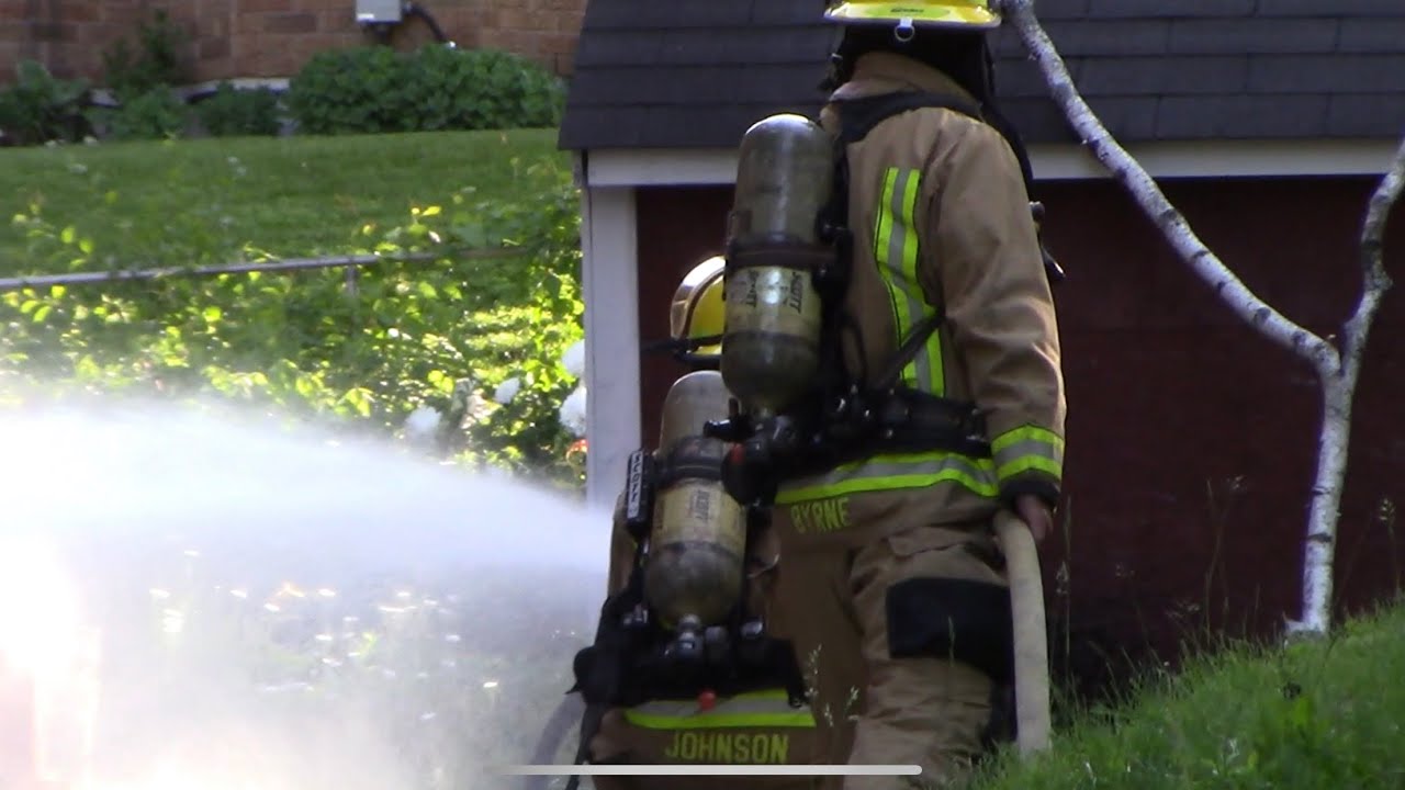 Firefighters extinguish flaming propane tank - YouTube