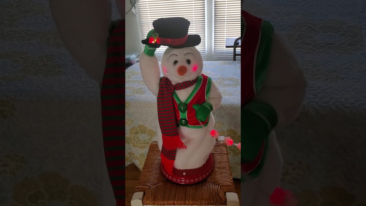 Gemmy red vest green trim snowflake spinning snowman - YouTube