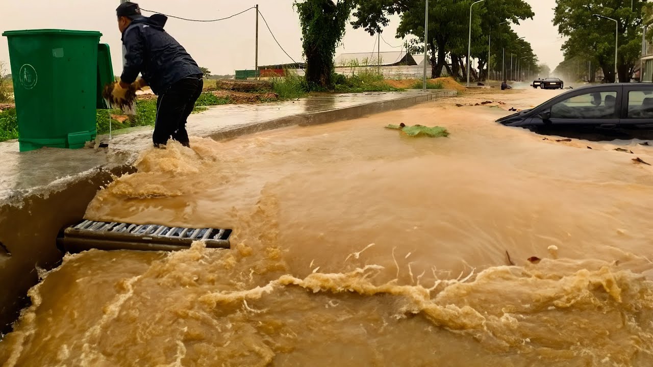 Clearing a Clogged Flash Flood Drain to Ward off Destruction - YouTube