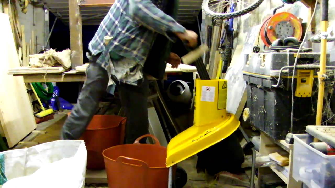 Apple mashing with garden shredder to make rough scrumpy Cider. - YouTube